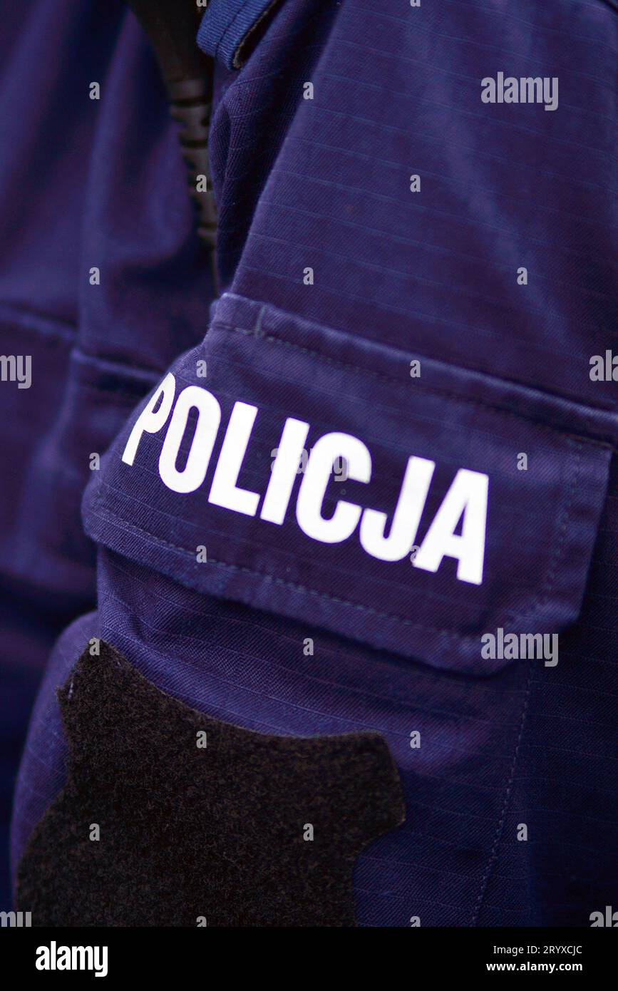 Police sign - logo on the back of the police uniform. Policja Stock ...
