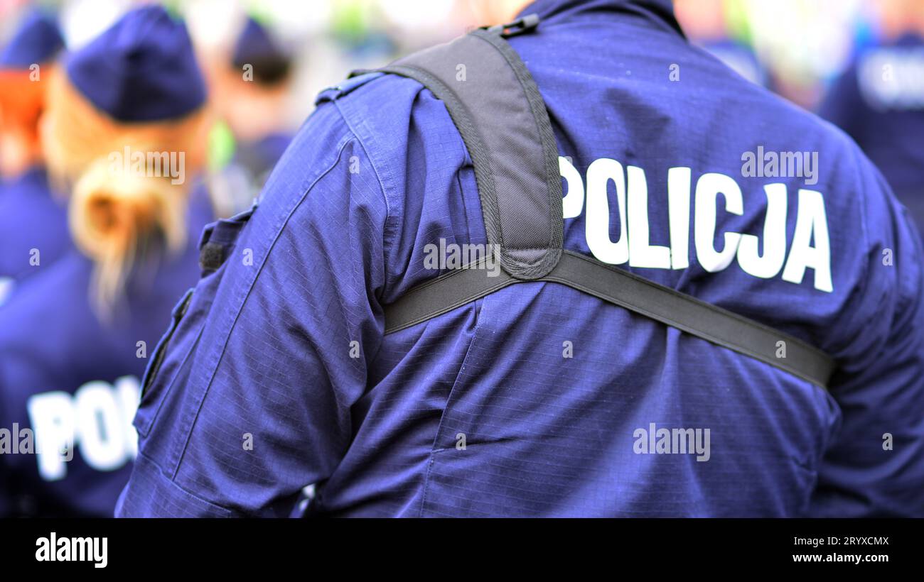 Police sign - logo on the back of the police uniform. Policja Stock ...