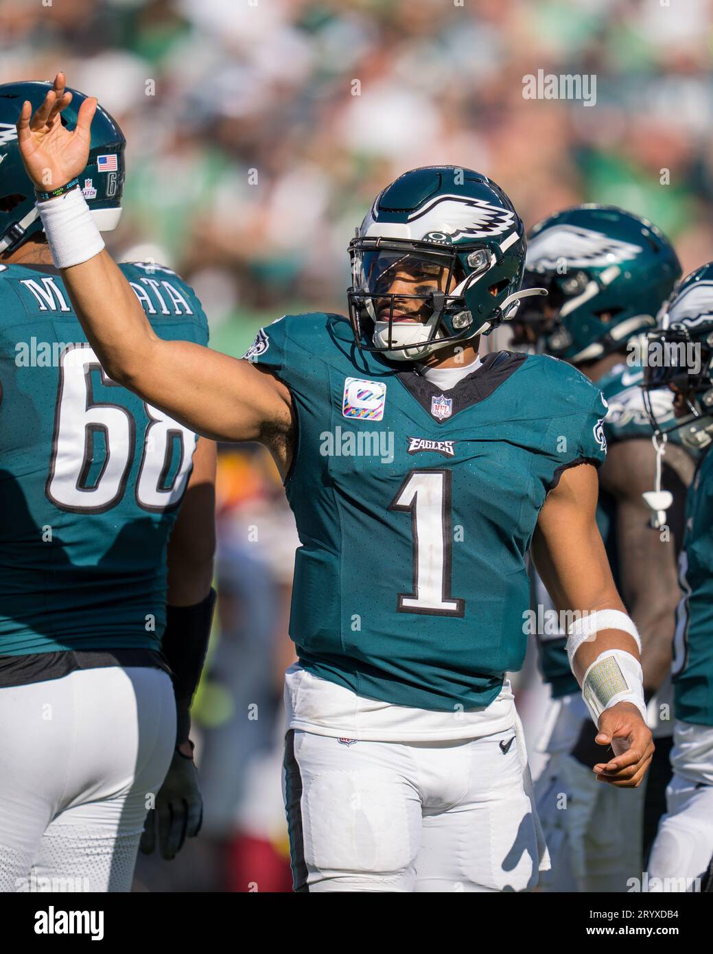 Jalen Hurts #1 of the Philadelphia Eagles signals to the bench against ...