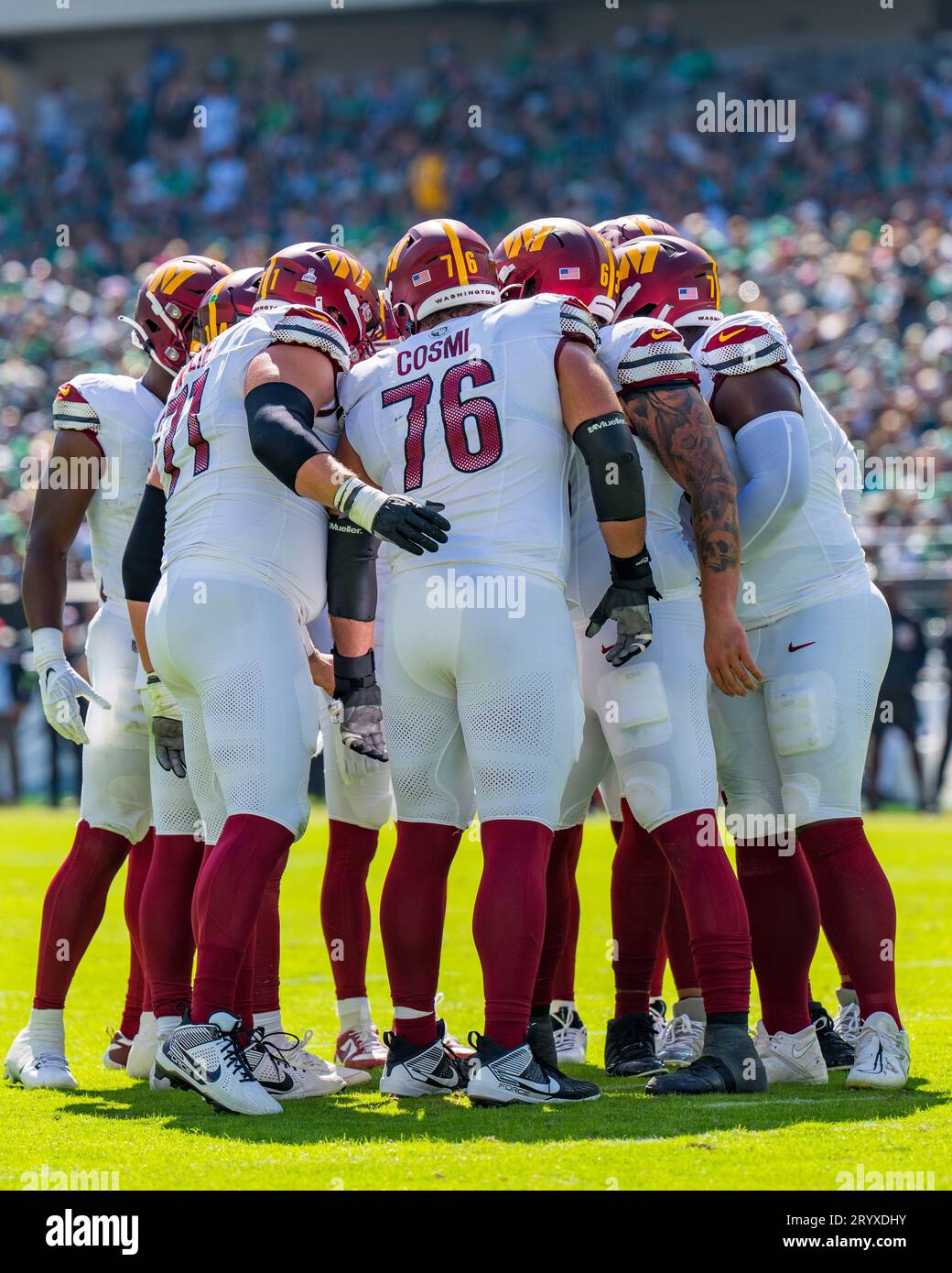The Washington Commanders offense huddle up prior to a play during the ...