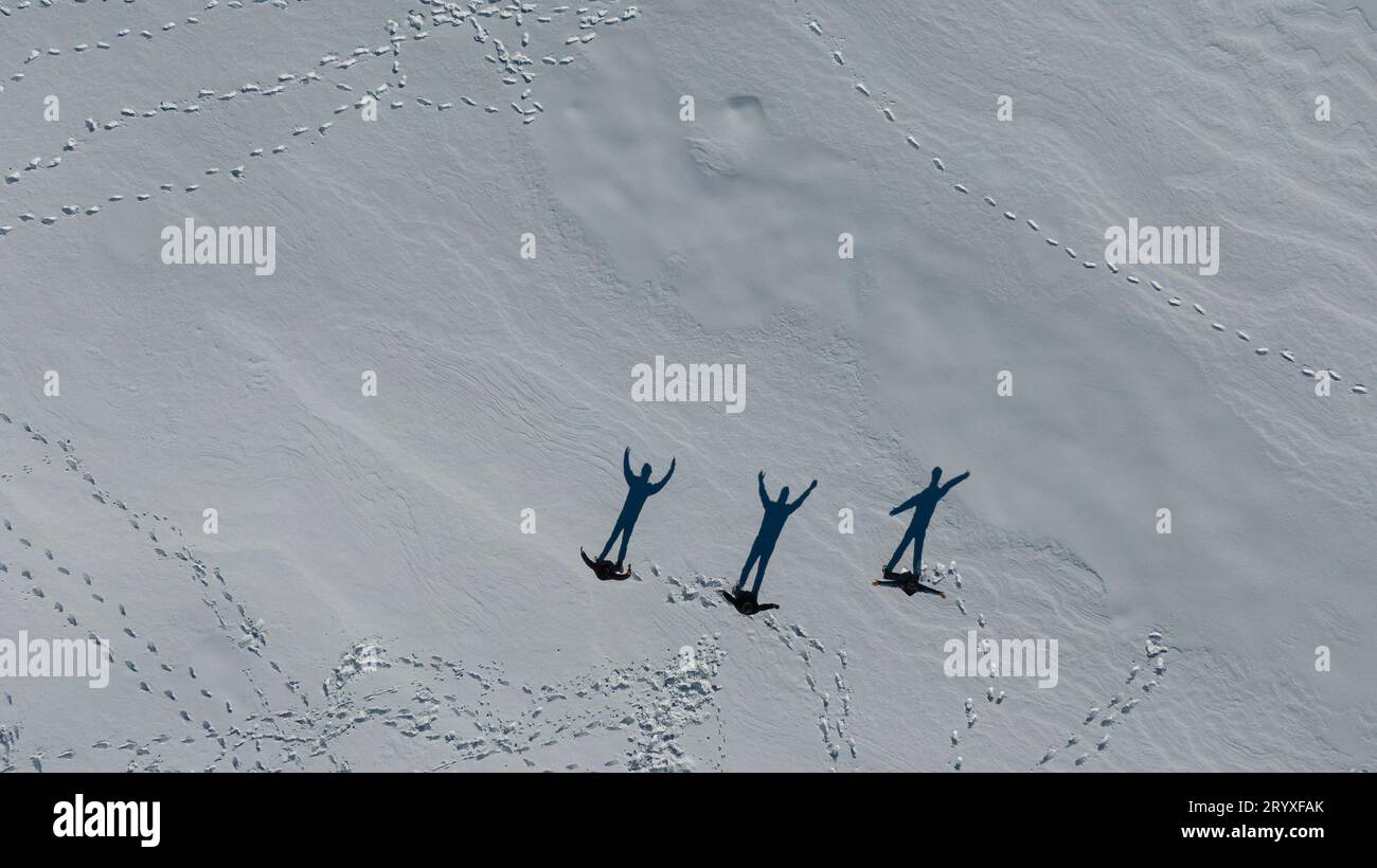 Human shadows and footprints on the snow Stock Photo - Alamy