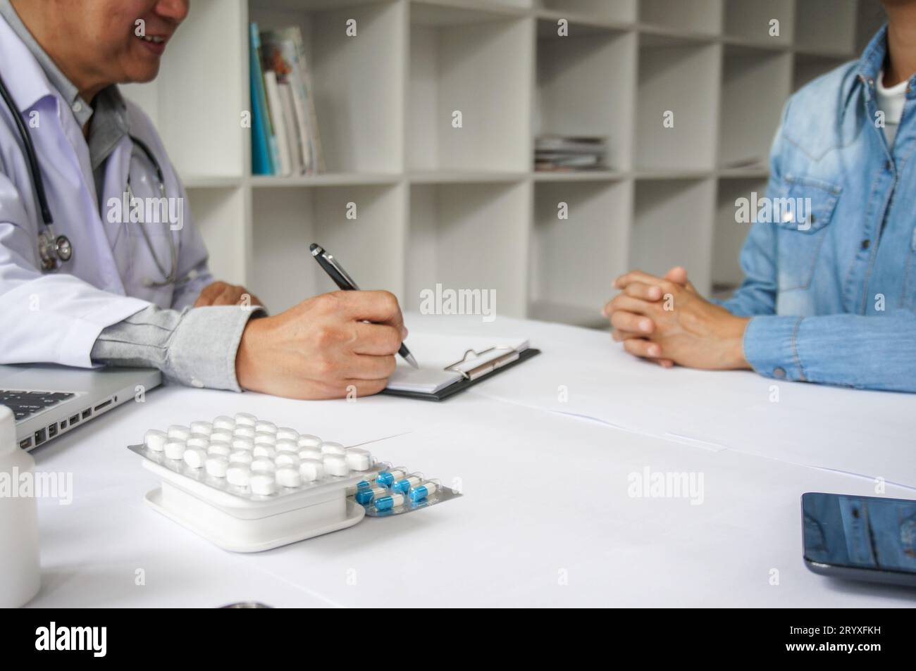 Medicine Doctor hand holding pack of different tablet blisters for ...