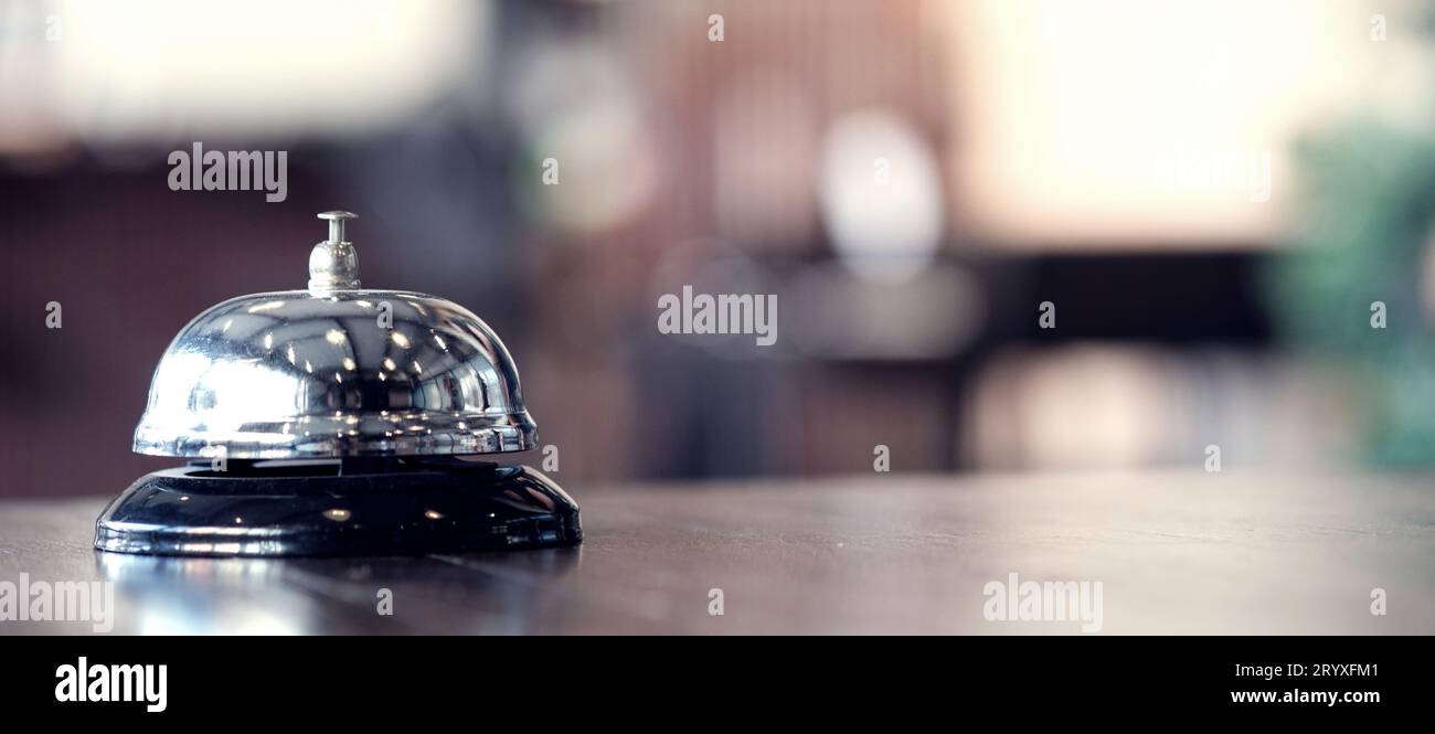 Hotel reception counter desk with service bell Stock Photo - Alamy