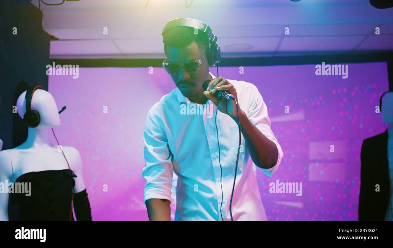 Happy person mixing music at dance party, using stereo and audio ...