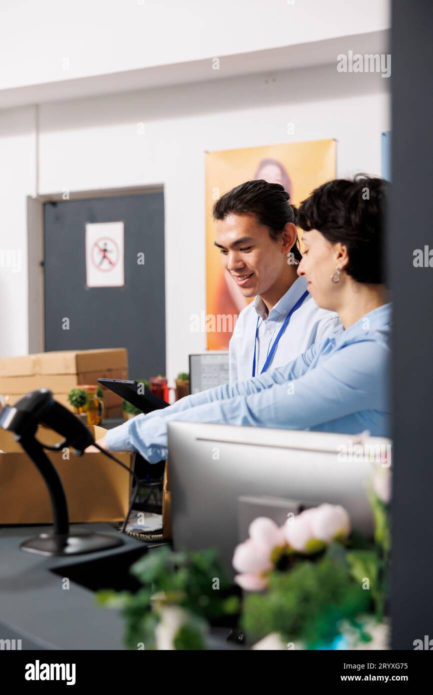 Delivery man putting carton boxes hi-res stock photography and images ...