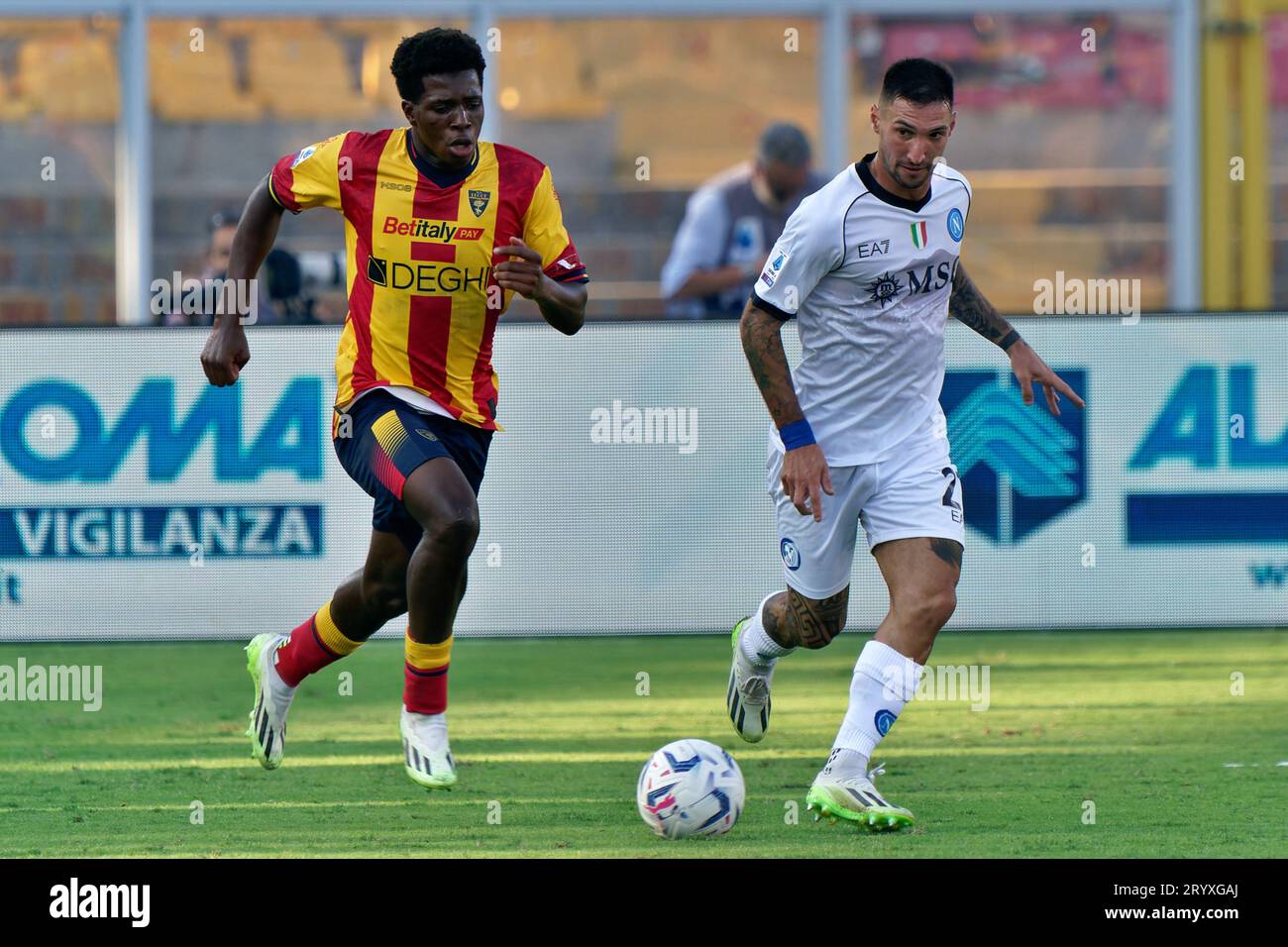 Lecce, Italy. 30th Sep, 2023. Matteo Politano (SSC Napoli) and Patrick ...