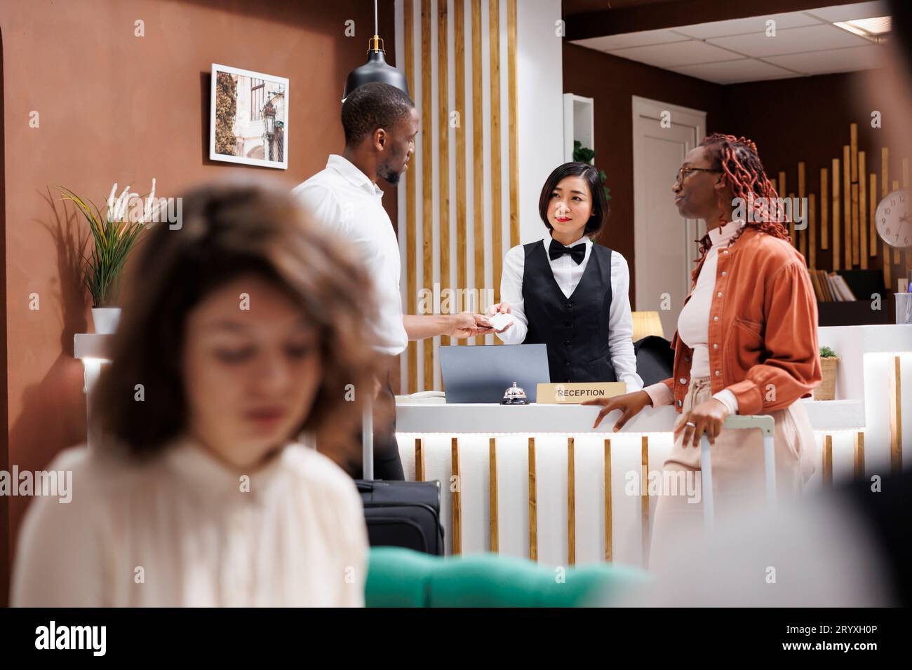 Tourists receiving access key card hi-res stock photography and images ...