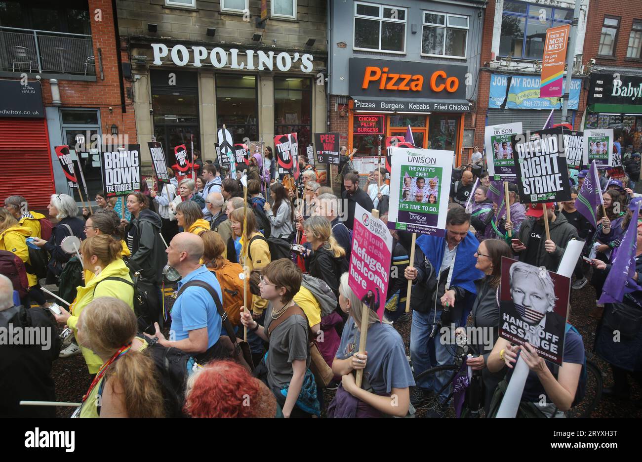 Manchester, UK. 01st Oct, 2023. Protesters hold anti-government signs ...