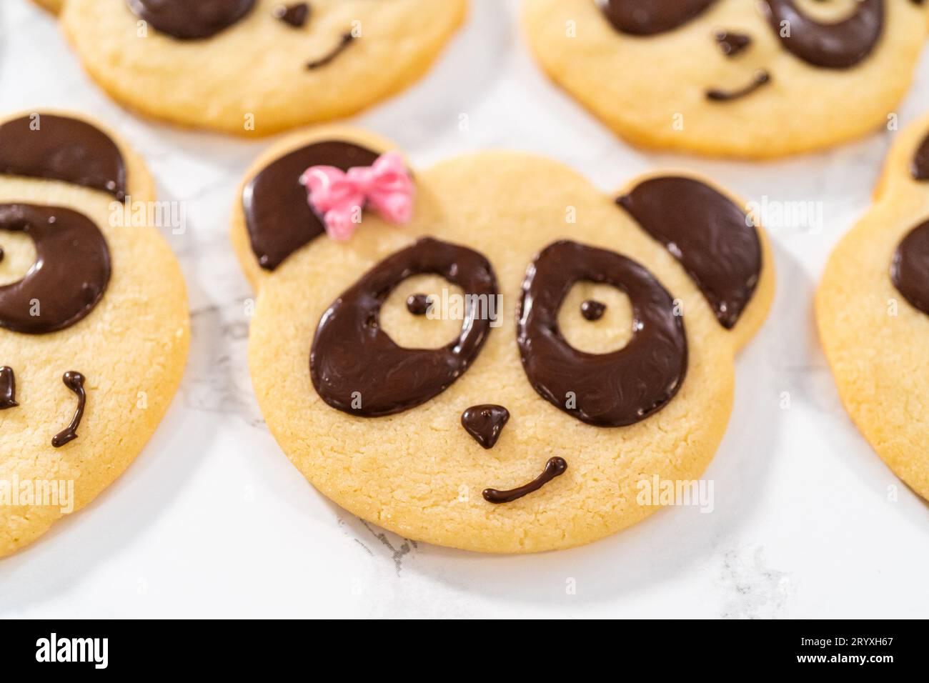Panda shaped shortbread cookies with chocolate icing Stock Photo - Alamy