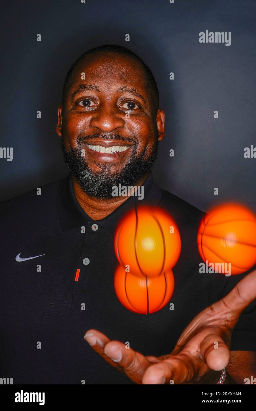 Milwaukee Bucks' head coach Adrian Griffin tosses some balls as he ...
