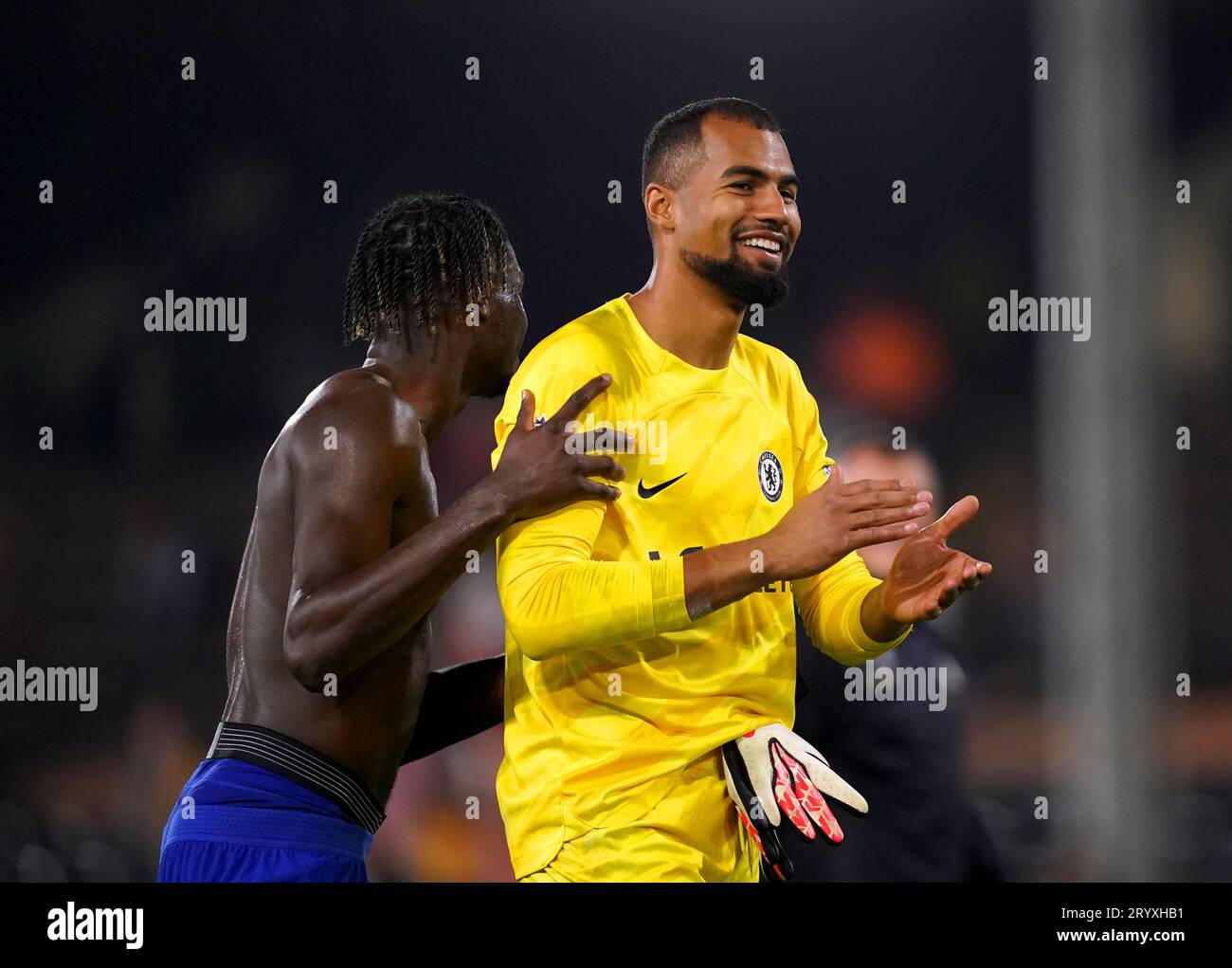 Chelsea goalkeeper Robert Sanchez (right) applauds the fans at the end ...