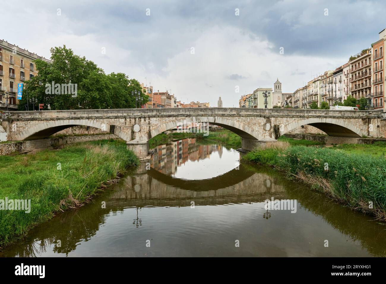 Colorful yellow and orange houses and bridge Pont de Sant Agusti ...