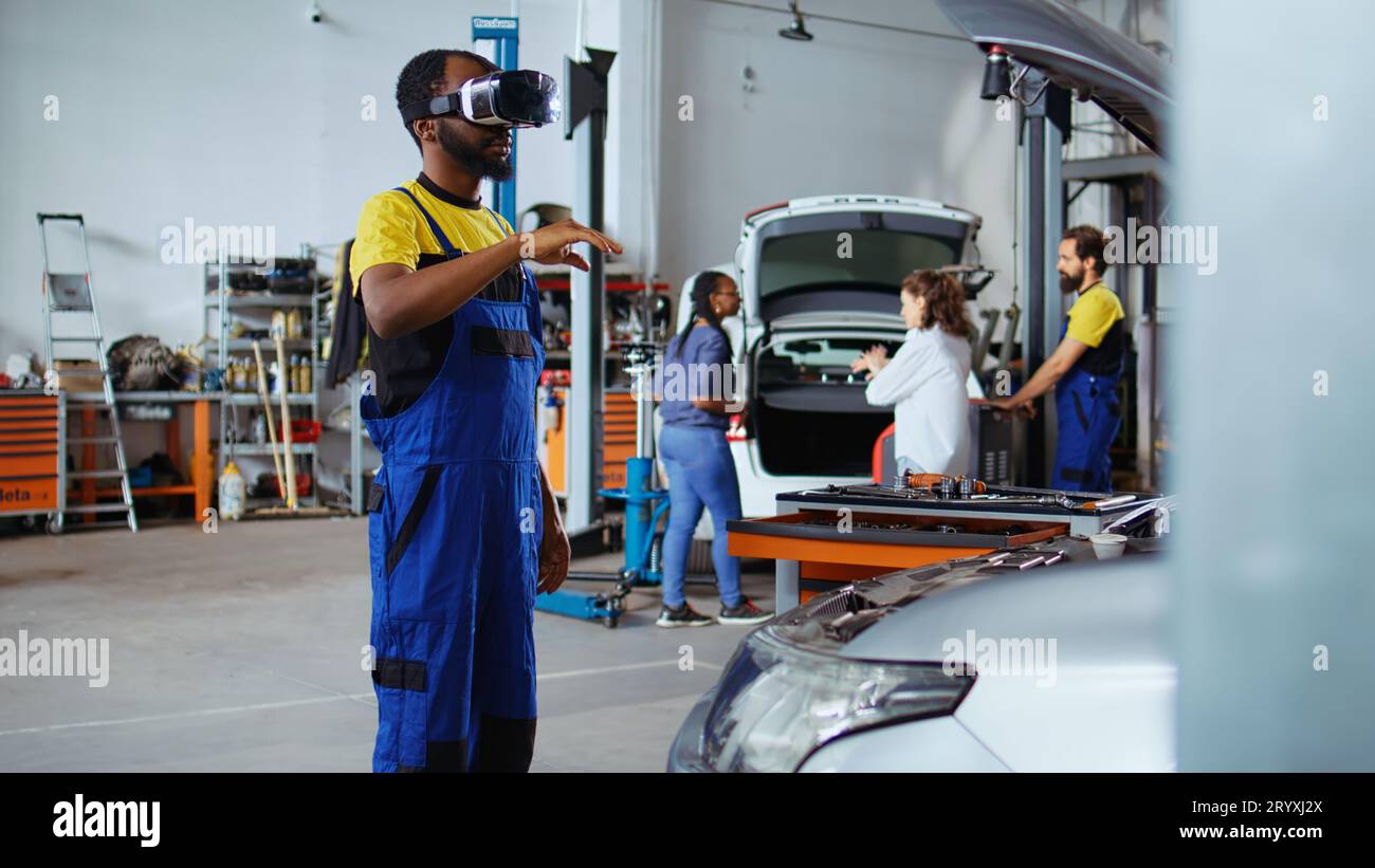 Portrait of african american smiling mechanic working in professional ...