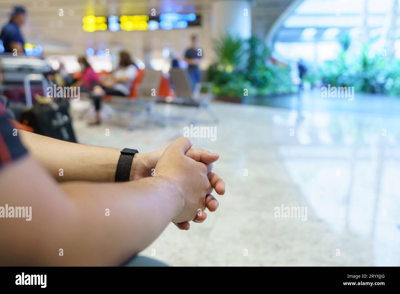Man Waiting For Flight In Airport Departure Area At Airport Waiting The