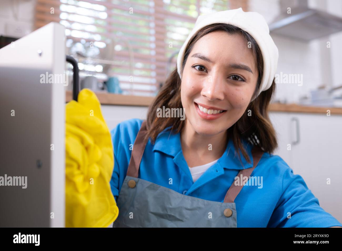 Woman in apron rubber gloves hi-res stock photography and images - Alamy
