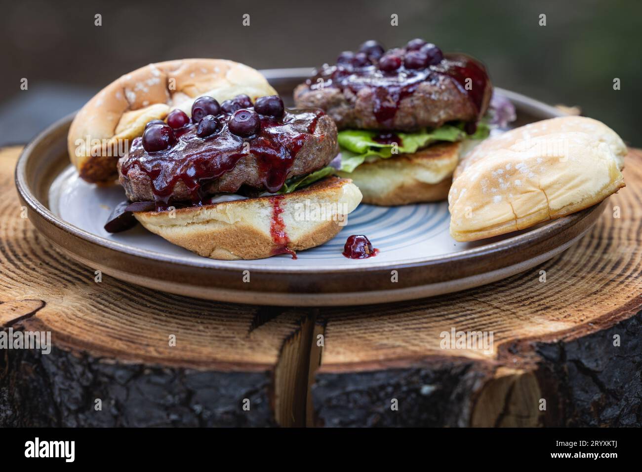 Fresh grilled beef burgers topped with a huckleberry bbq sauce and ...