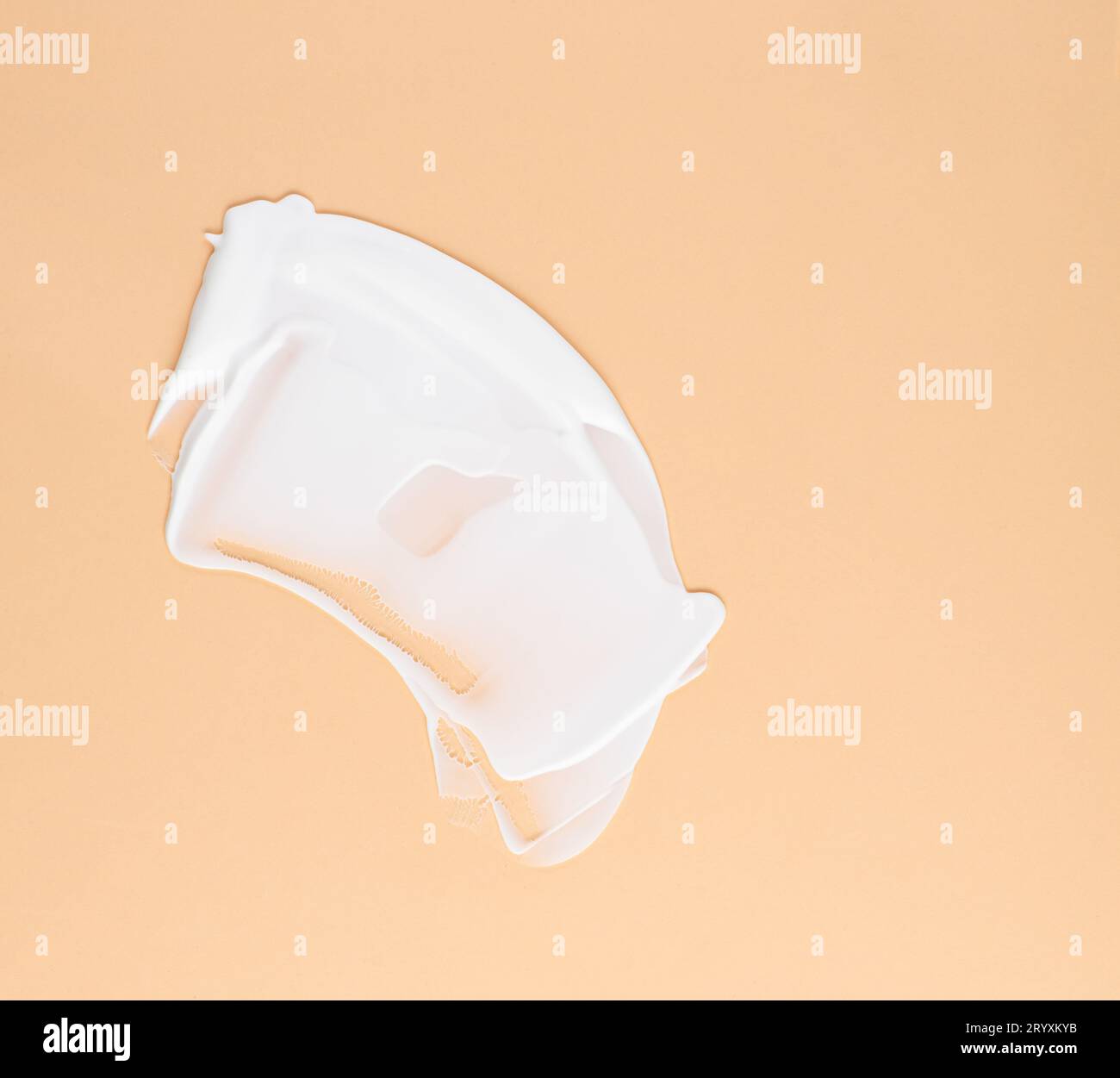 Smear of white cream for face and body on a brown background Stock ...