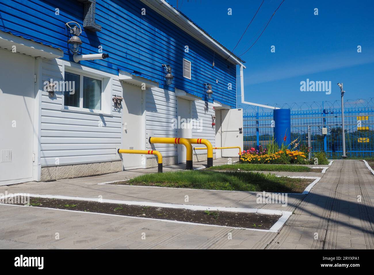 View of territory of gas distribution station from outside on sunny ...