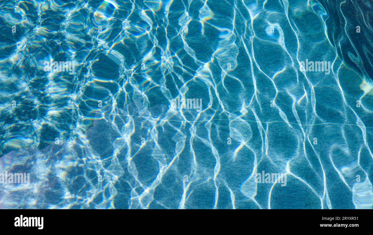 Abstract pool water. Swimming pool bottom caustics ripple and flow with ...