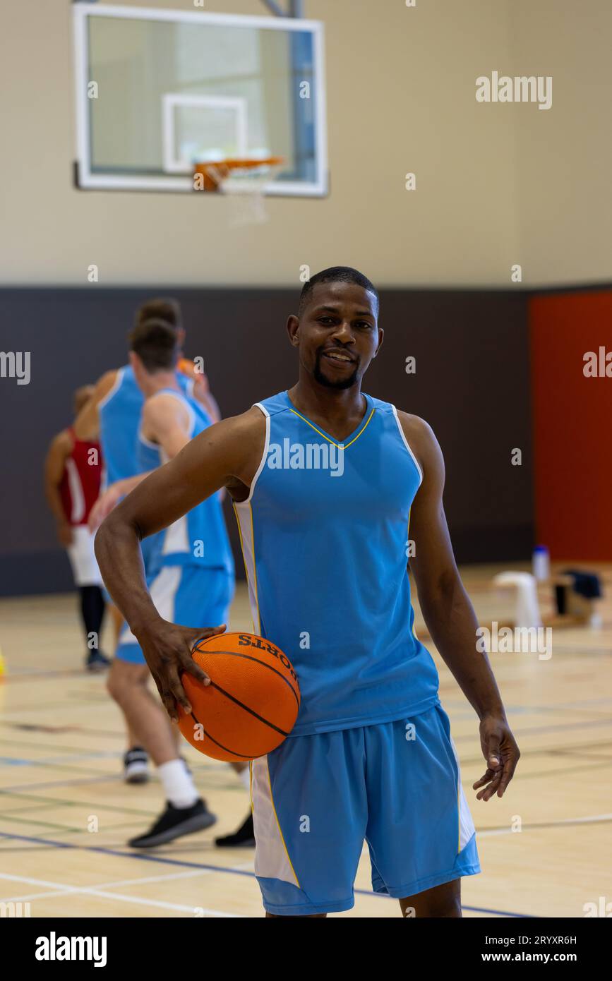 Happy diverse male basketball players hi-res stock photography and ...