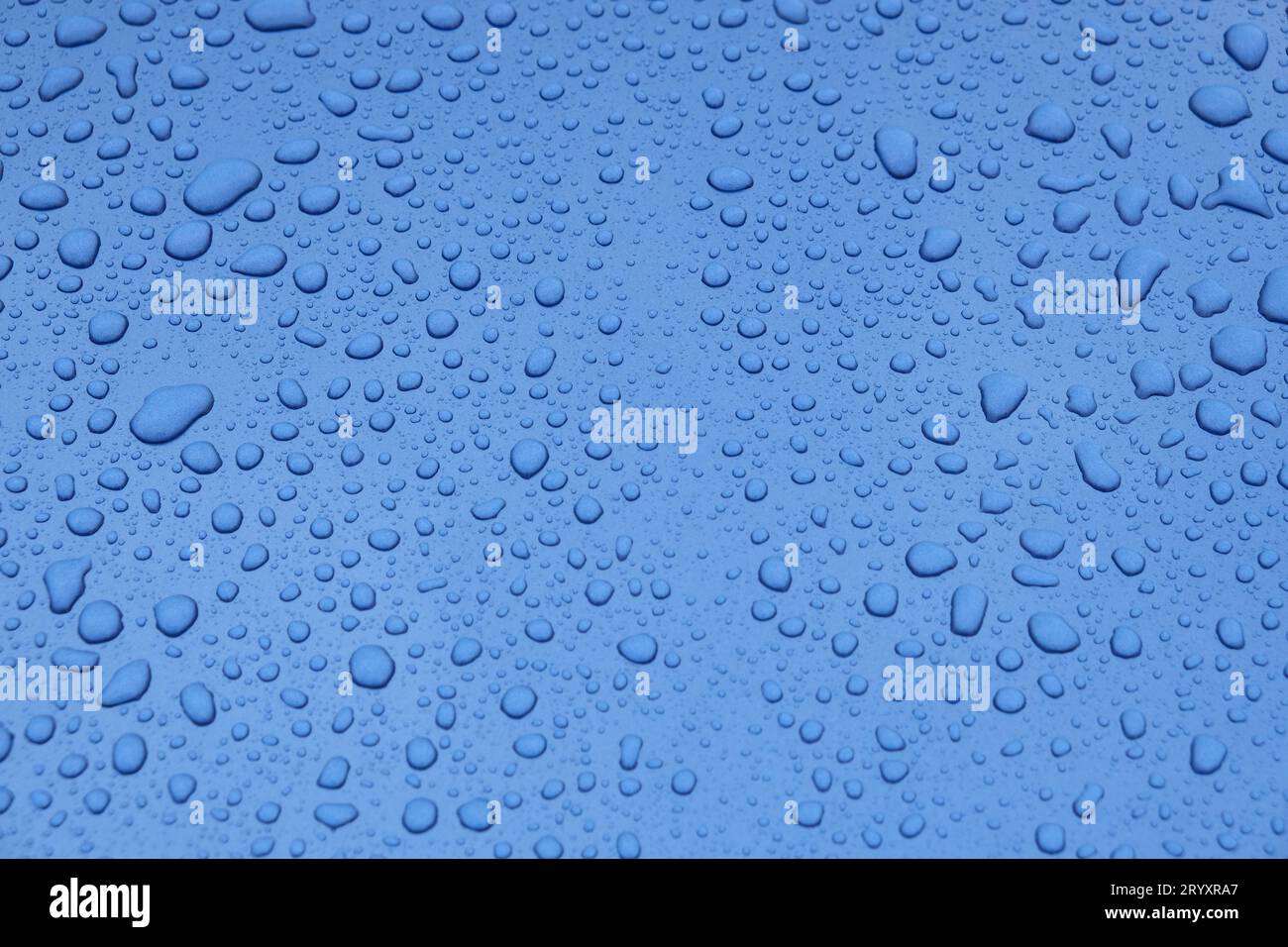 Water drop abstract background wallpaper on blue color wet surface area ...