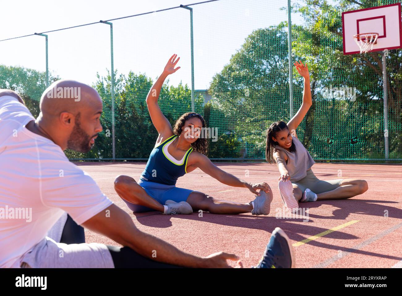Three friends warming up together hi-res stock photography and images ...