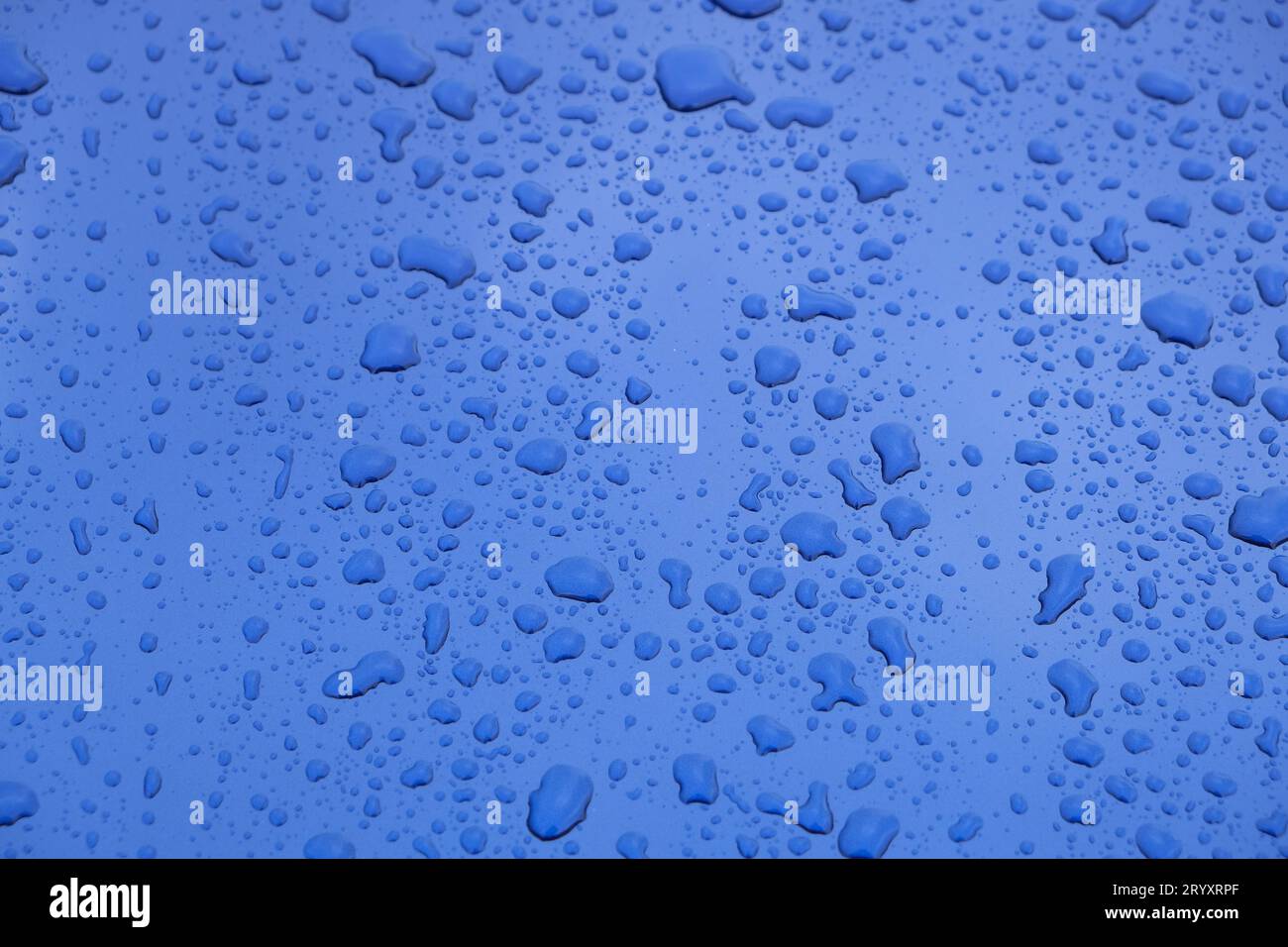 Water drop abstract background wallpaper on blue color wet surface area ...