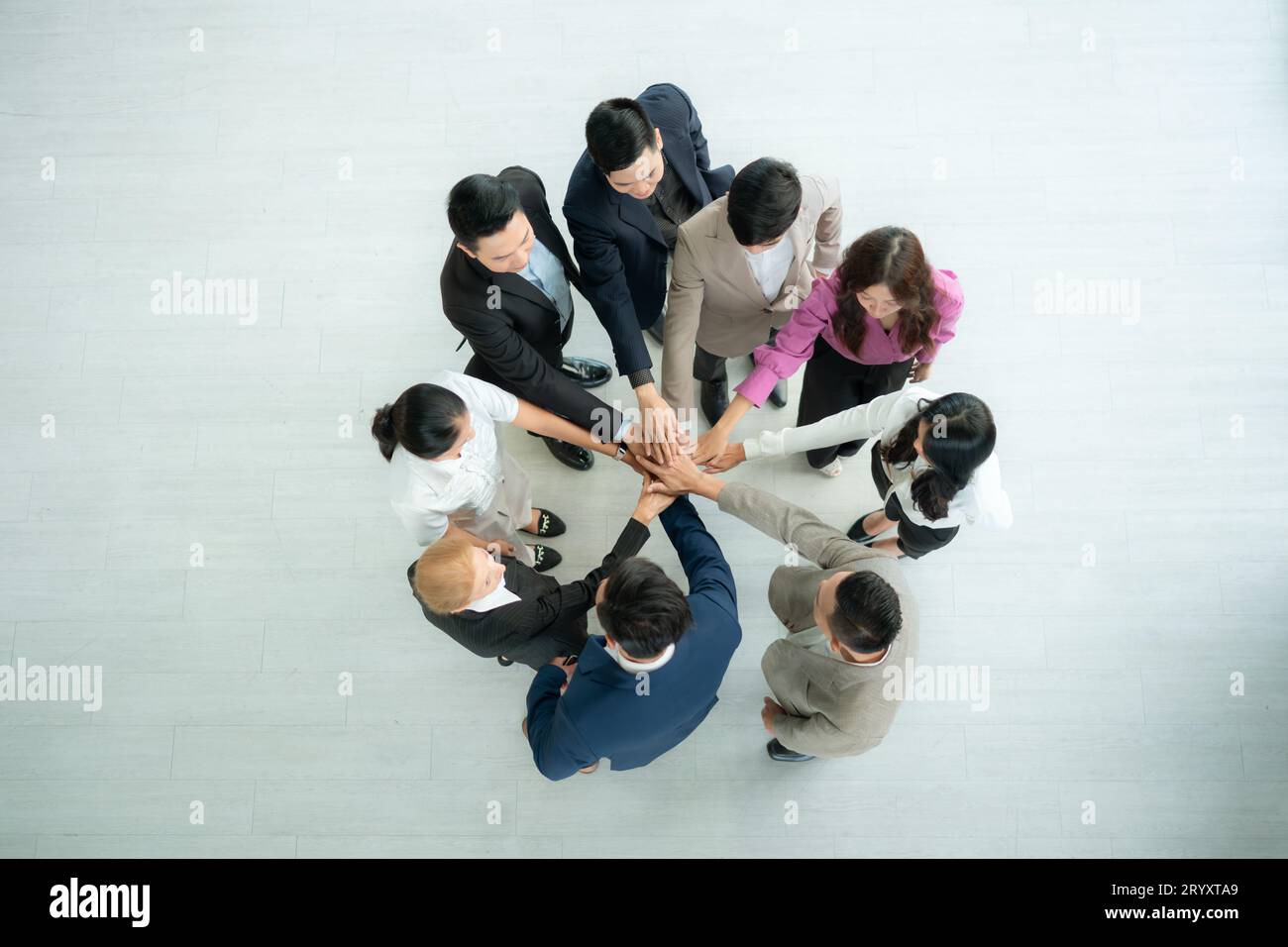 Top view of group of business people joining hands together in office ...