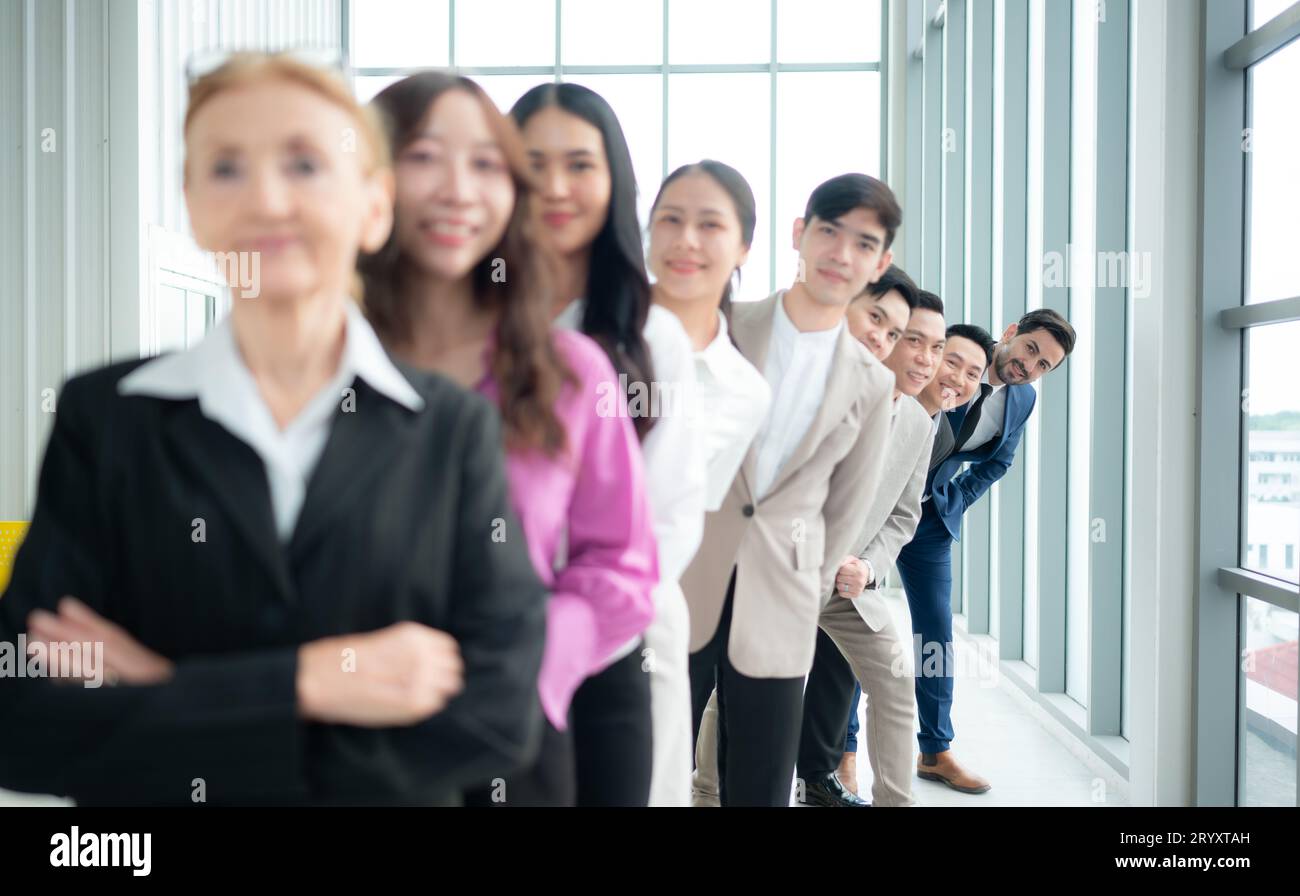 Group of business people standing in line in conference room used for ...