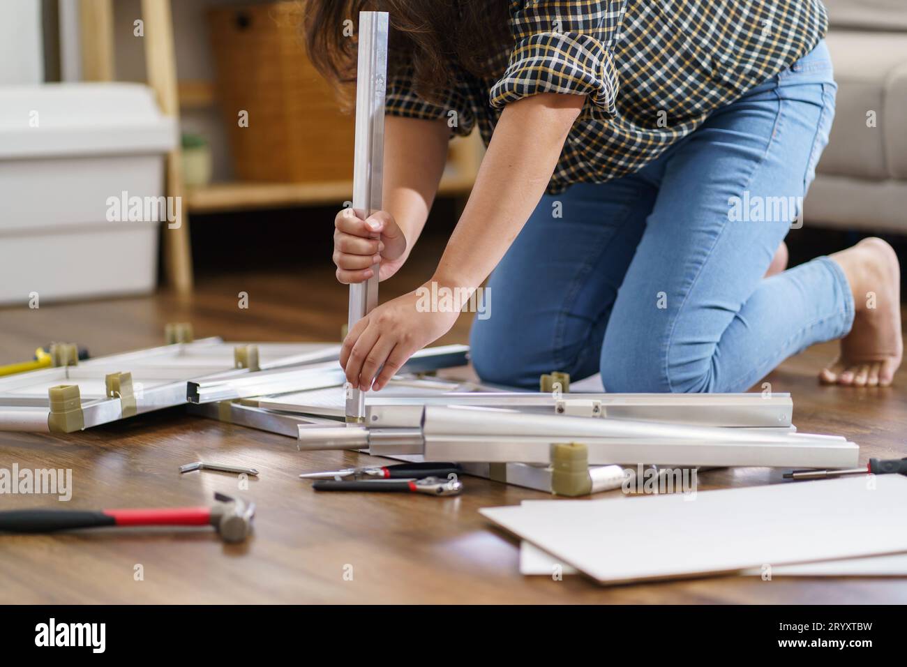 Asian Woman self repairs furniture renovation using equipment to diy ...
