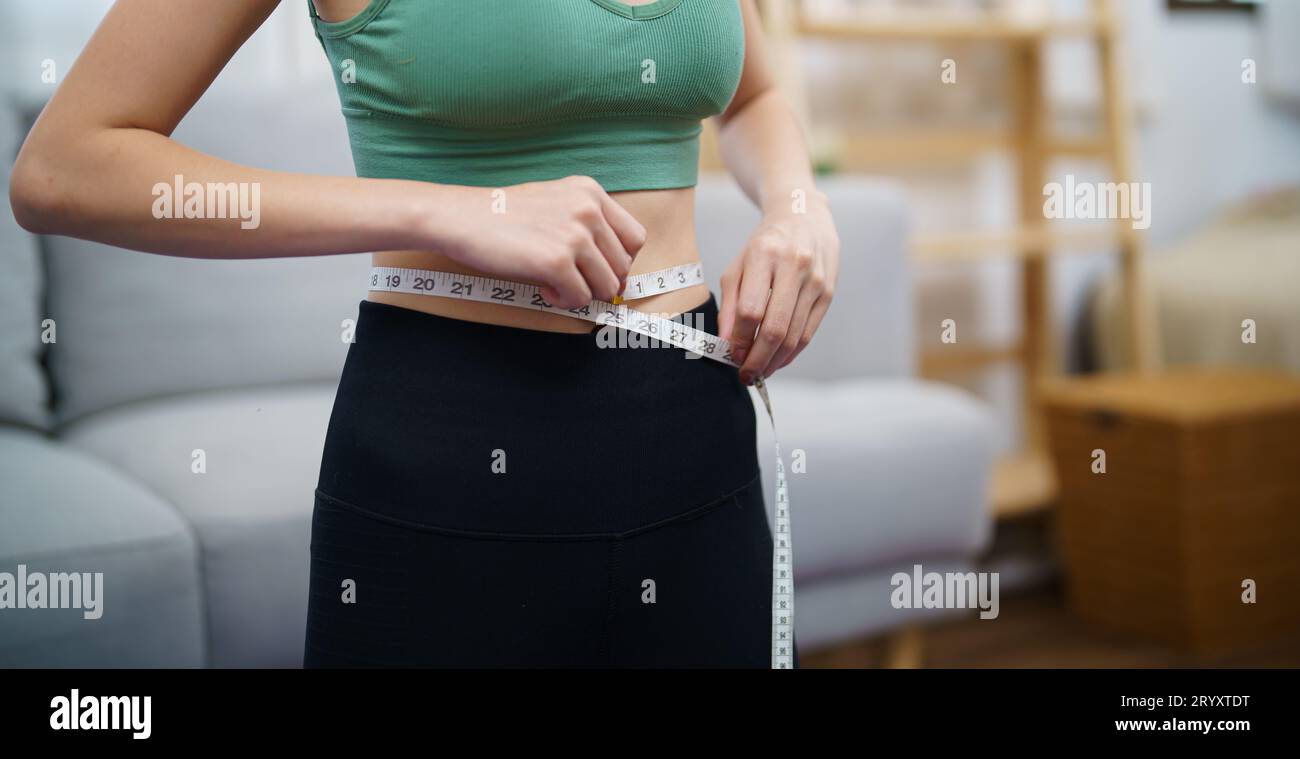 Asian healthy woman dieting Weight loss. Slim woman measuring waist ...