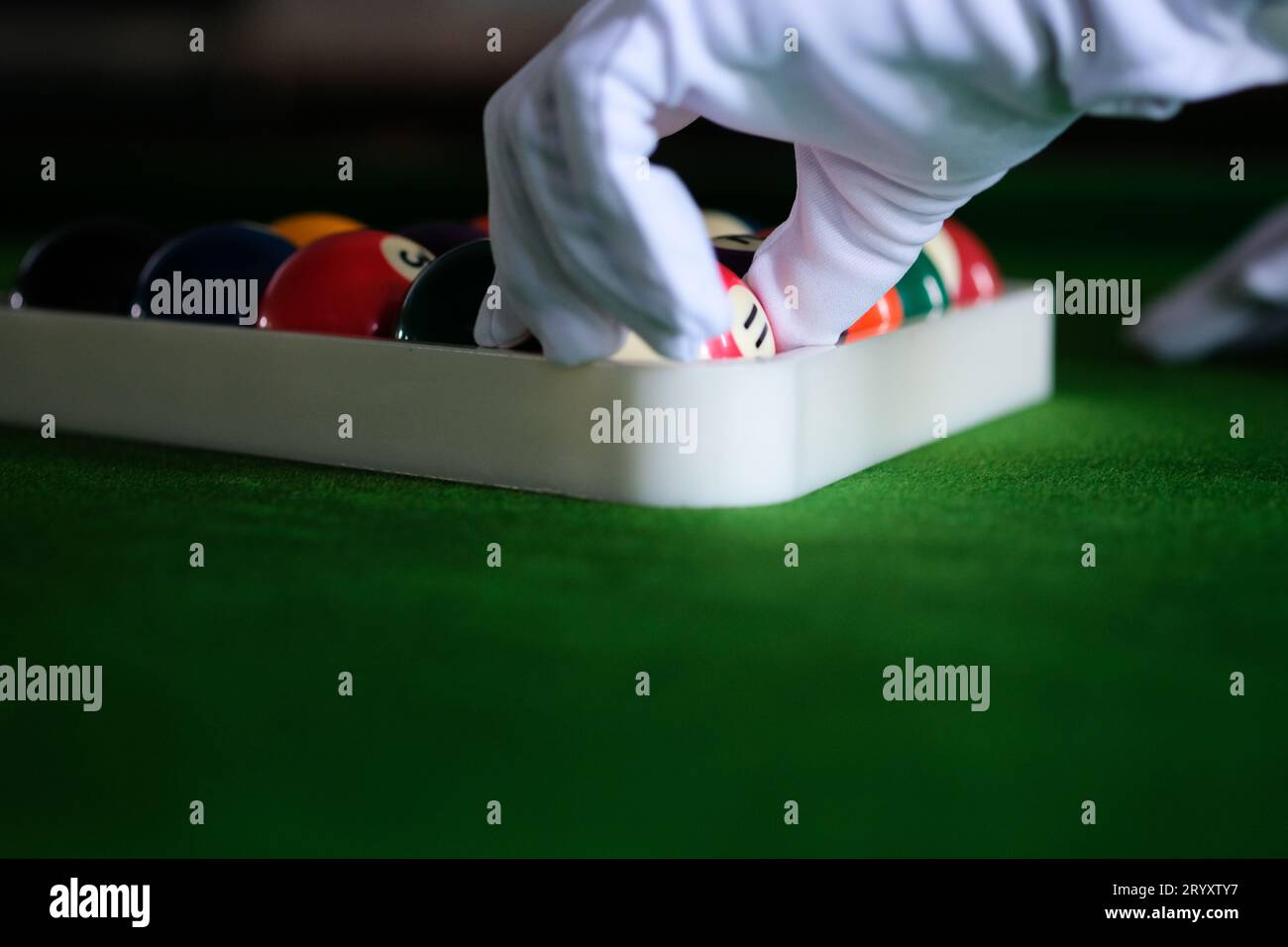 Man's hand and Cue arm playing snooker game or preparing aiming to ...