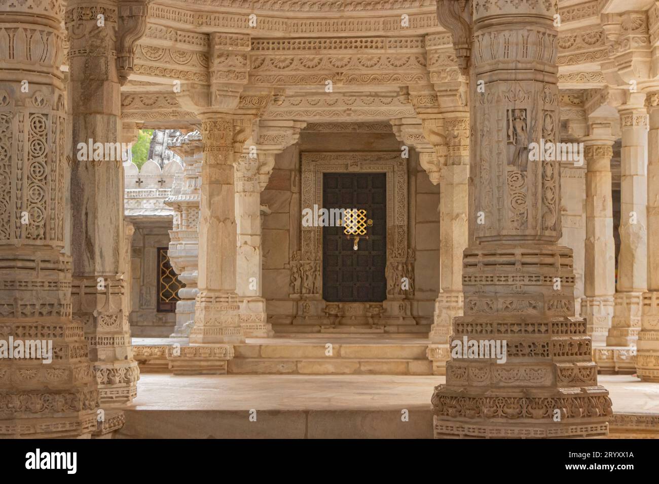 Inside the temple of one thousand pillars looking at a wooden door ...