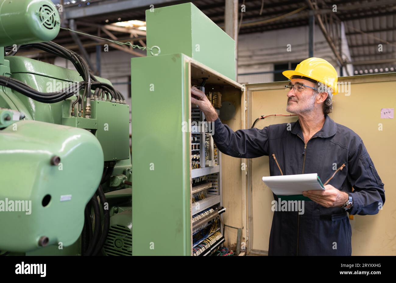Senior engineer inspects the electrical system and repairs the ...