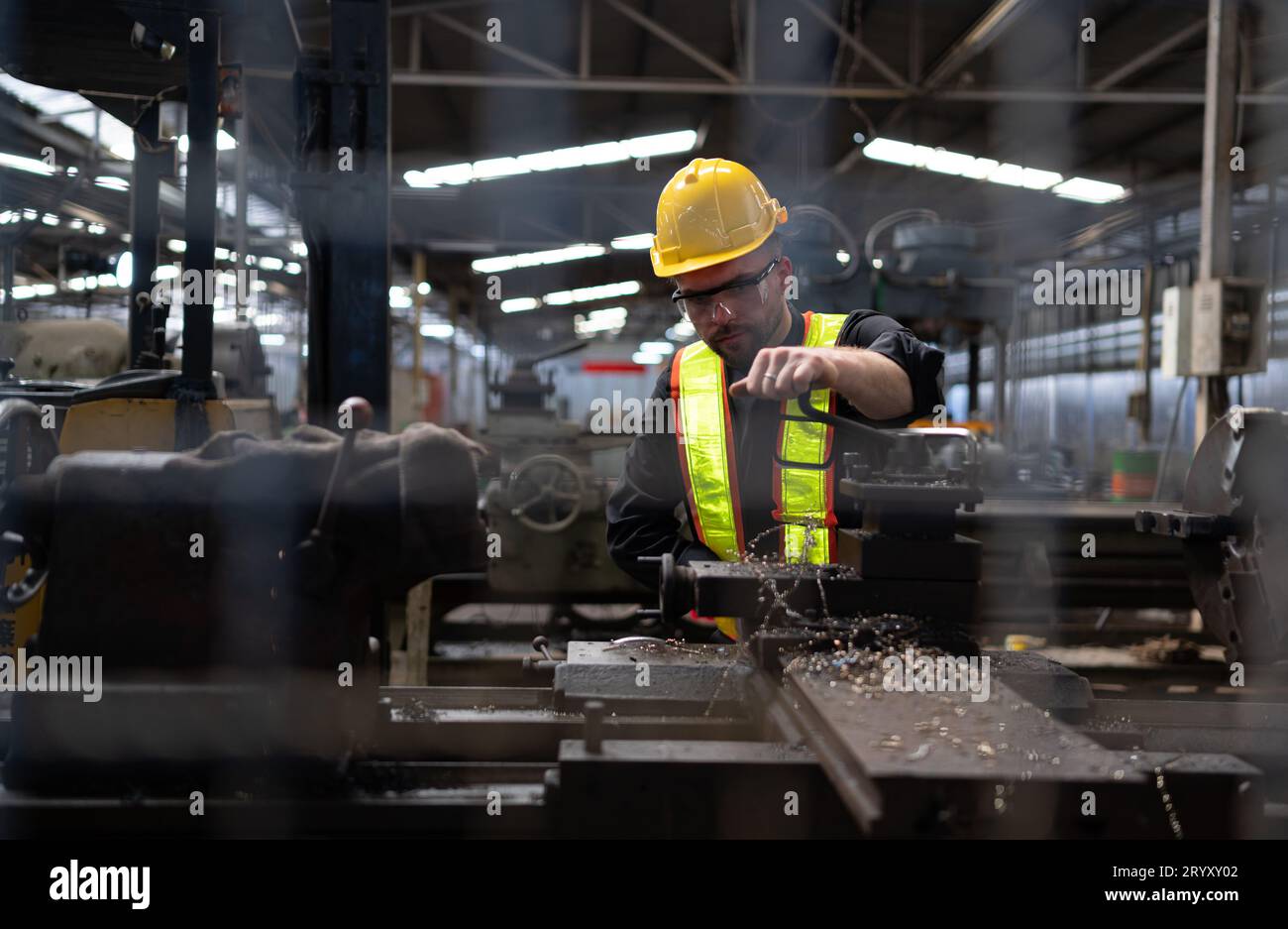 Mechanical engineers enter the old machinery warehouse to inspect and ...