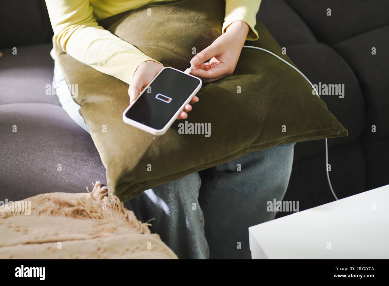 Woman hands Charging mobile phone battery with low battery. plugging a ...
