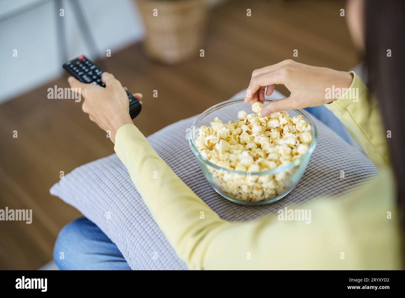 Asian woman Watching smart TV and using remote controller Hand holding ...