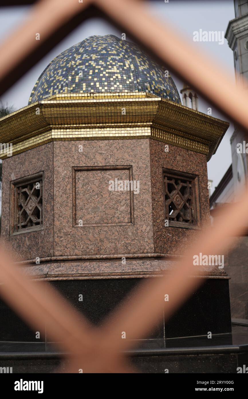 a small domed monument, with ceramic material surrounding it Stock ...