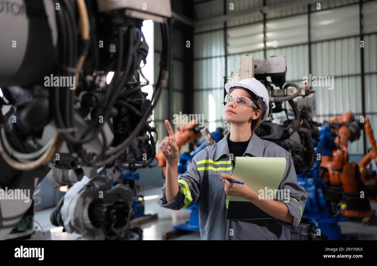 A female engineer checking documented items after installing a program ...
