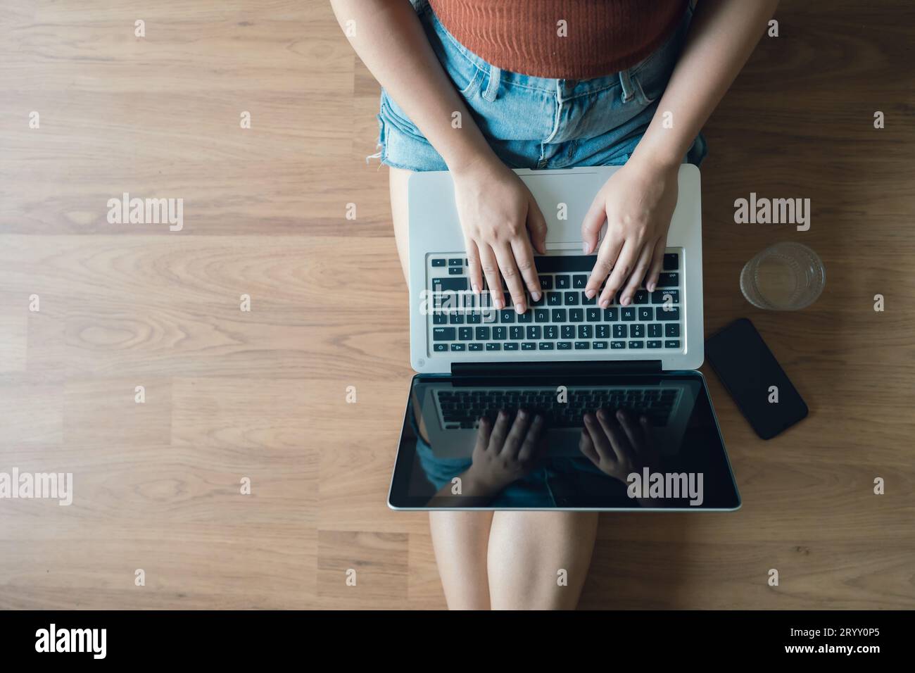 Woman Working by using laptop blank screen computer . Hands typing on a ...