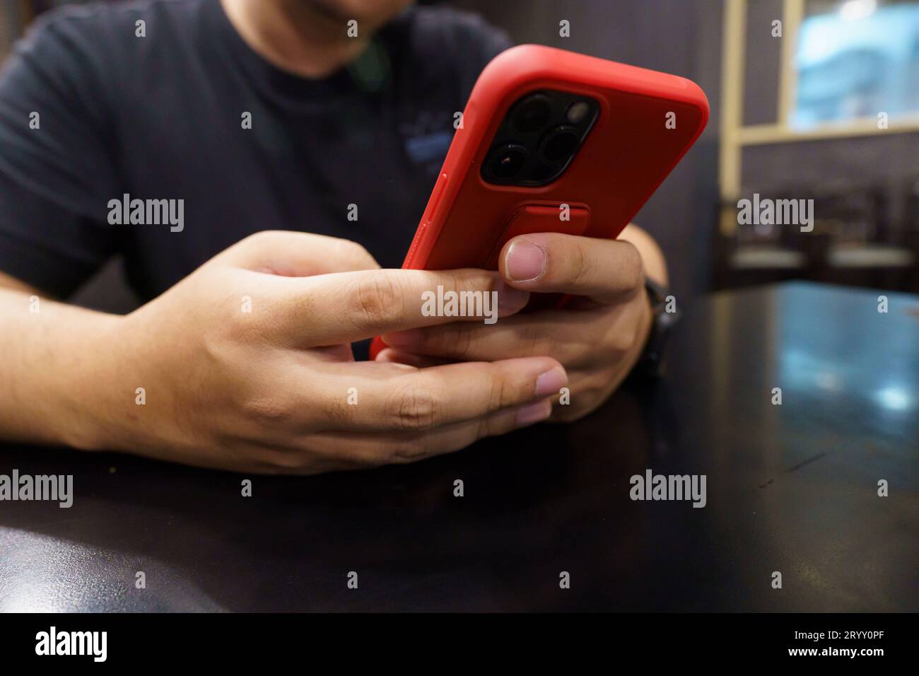 Man playing game on mobile phone. gamer boy playing video games holding ...