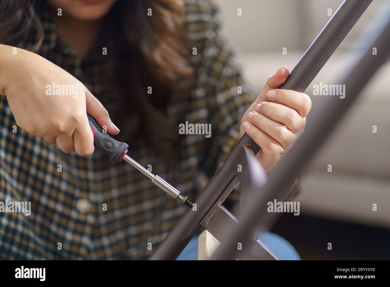 Asian Woman self repairs furniture renovation using equipment to diy ...
