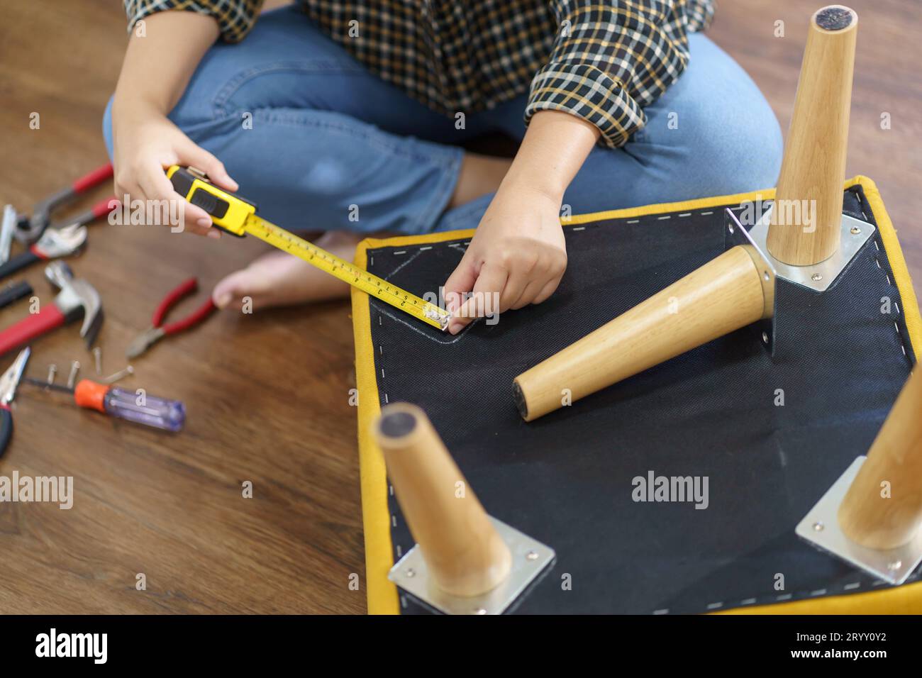 Asian Woman self repairs furniture renovation using equipment to diy ...