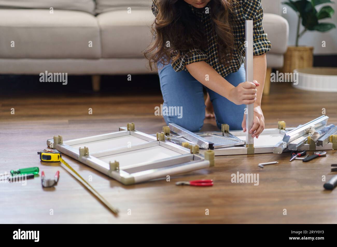 Asian Woman self repairs furniture renovation using equipment to diy ...