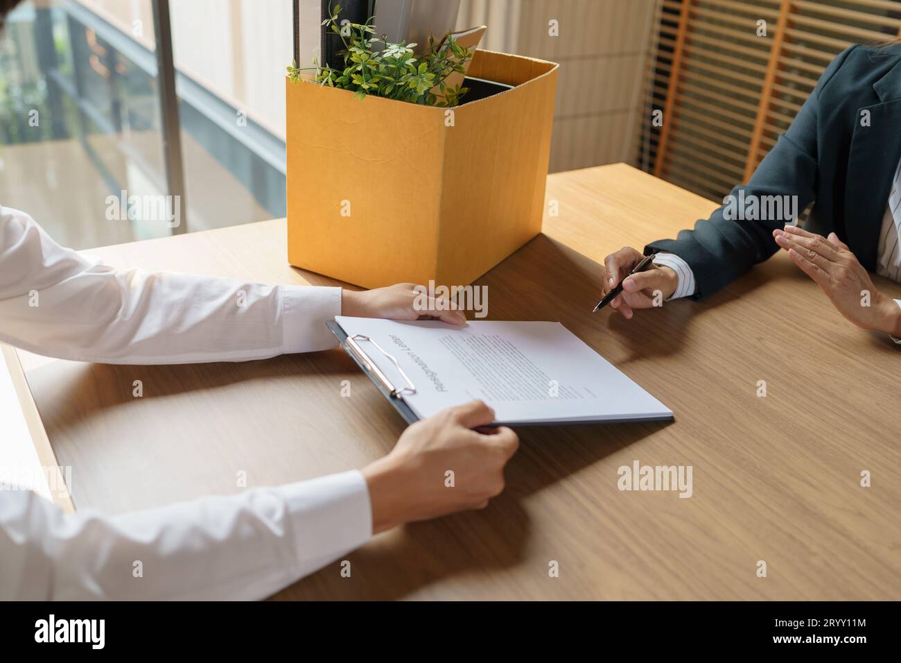 Leaving work carrying box hi-res stock photography and images - Alamy