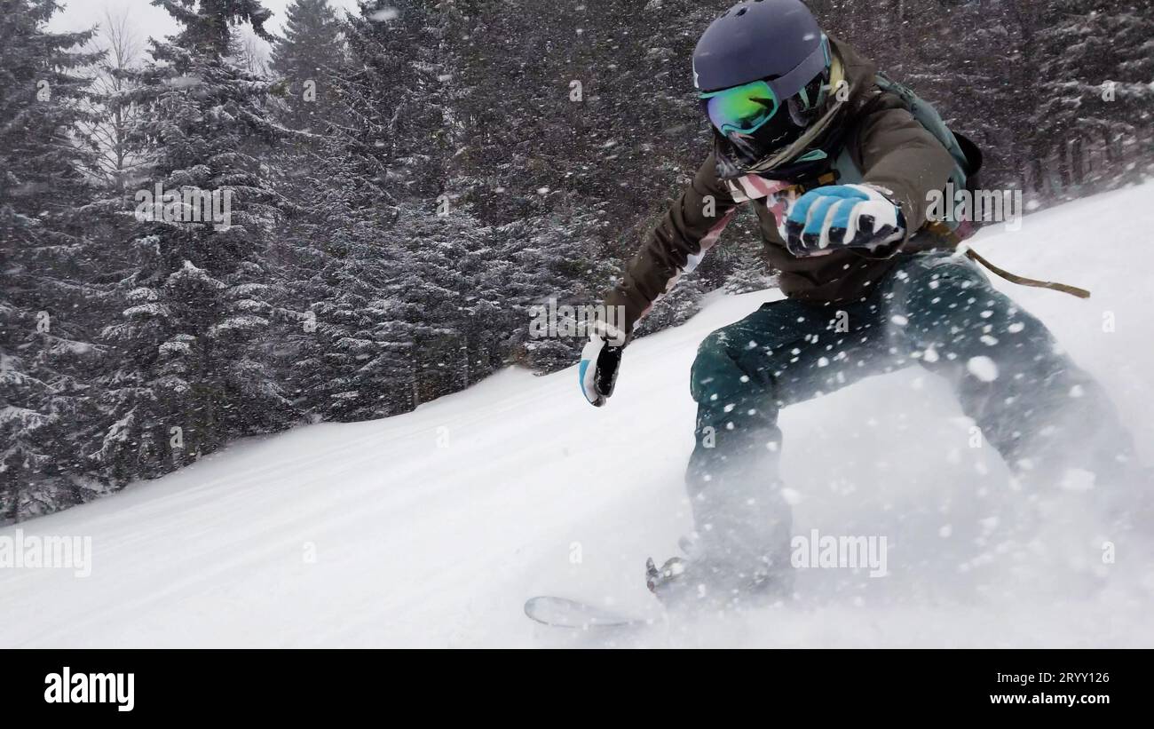 Girl snowboarding on slopes. Snow falling Stock Photo - Alamy