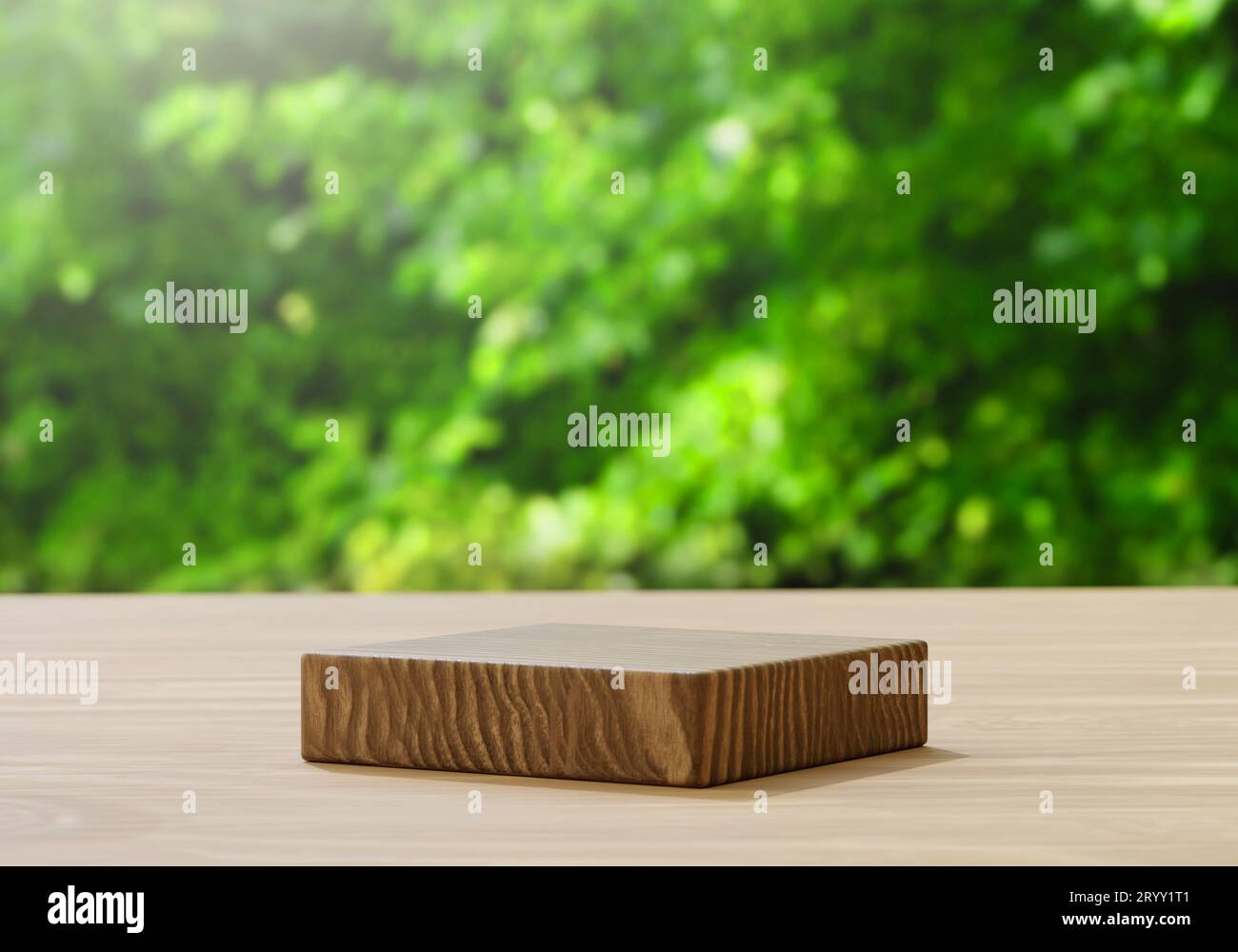 Wooden product display podium with blurred nature green leaves ...