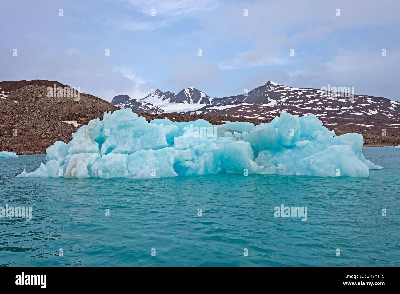 Colorful Iceberg Floating by Barren Arctic Shores in teh Svalbard ...