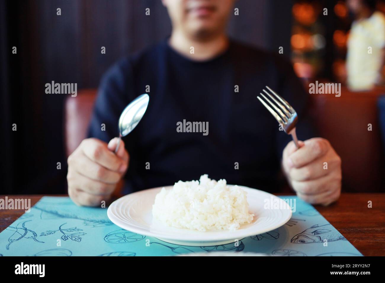 Man eating rice enjoying a meal in restaurant. man having dinner Stock ...