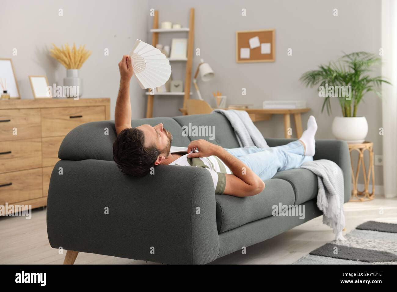 Fanning himself fan hi-res stock photography and images - Alamy